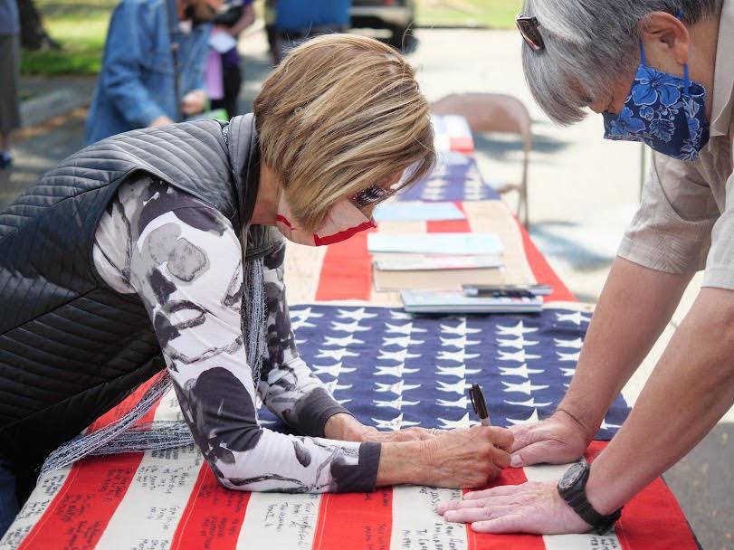 FEATURE: Flag-signing event brings history to the forefront - Issuu